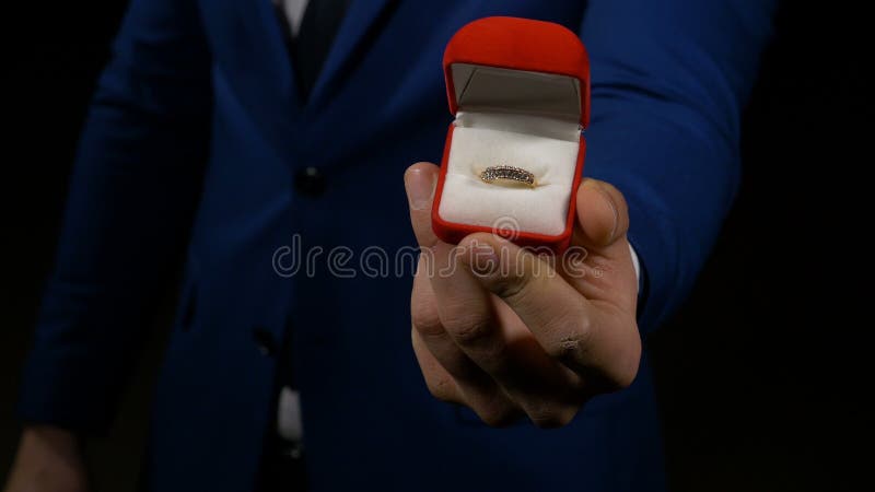 Hands of an Elegant Man Holding and Presenting Jewelry Box with Ring ...