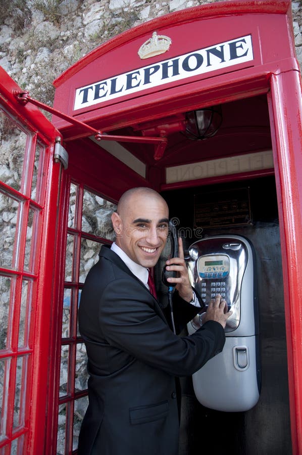 Business Man on the Public Phone Stock Photo - Image of outdoors, happy ...