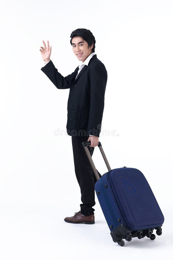 A Business Man Pulling Luggage and Waving Hand Stock Photo - Image of ...