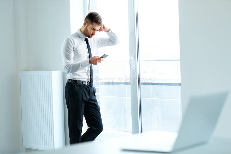 Business Man Reading Something on the Screen of His Cell Phone Stock ...