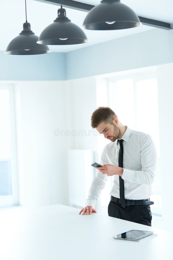 Business Man Reading Something on the Screen of His Cell Phone Stock ...