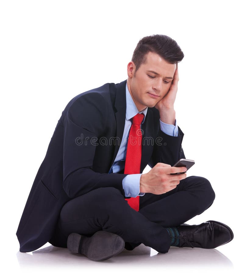 Man on the floor texting stock photo. Image of glasses - 29636556