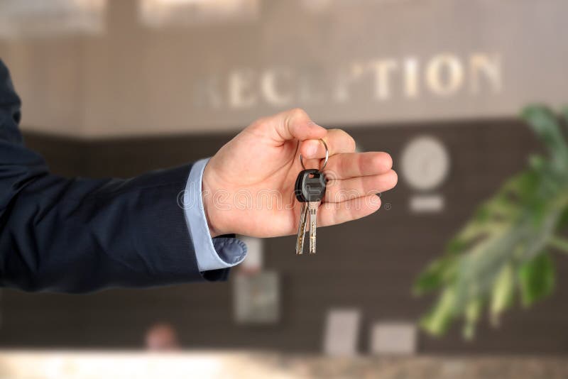 Business Man at the Reception Giving Keys Stock Image - Image of ...
