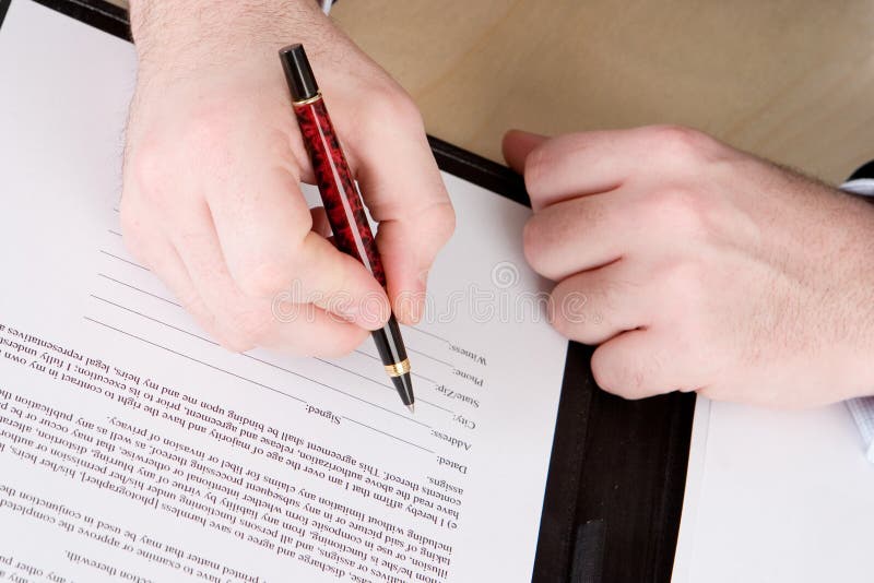 A Business Man with a Red and Black Pen about To Sign a Document Stock ...
