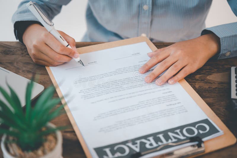 Business Man`s Hand is Signing a Contract in the Agreement Stock Image ...