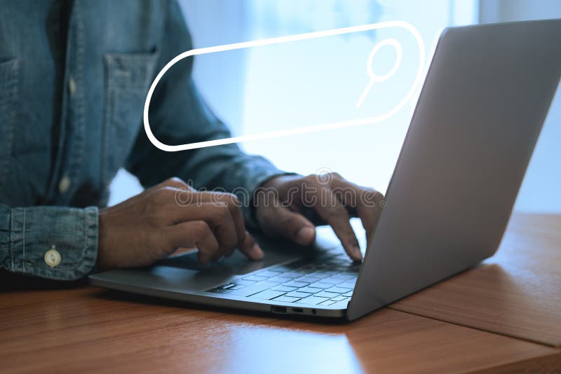 A Business Man Searching for the Internet on a Laptop Stock Image ...