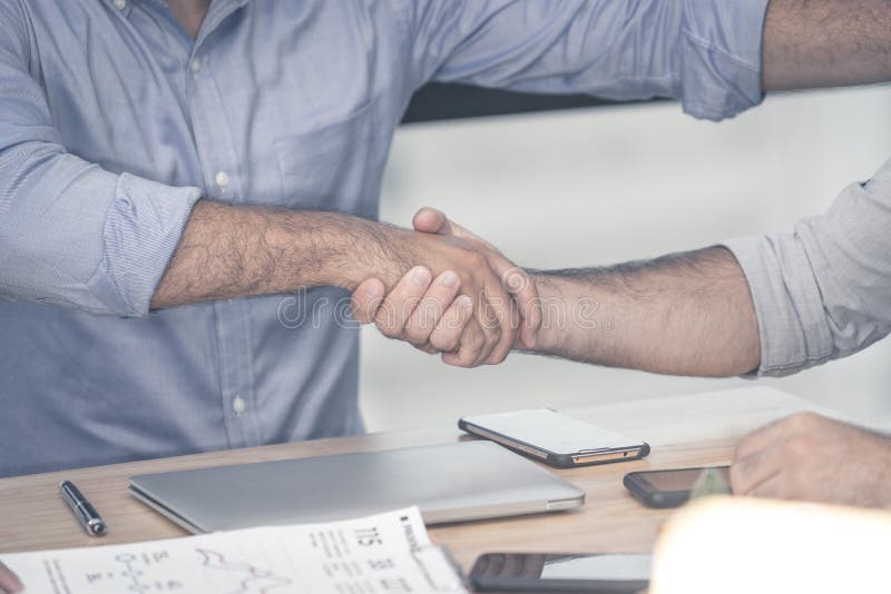 Business Man Shaking Hands on Office Desk Stock Photo - Image of ...