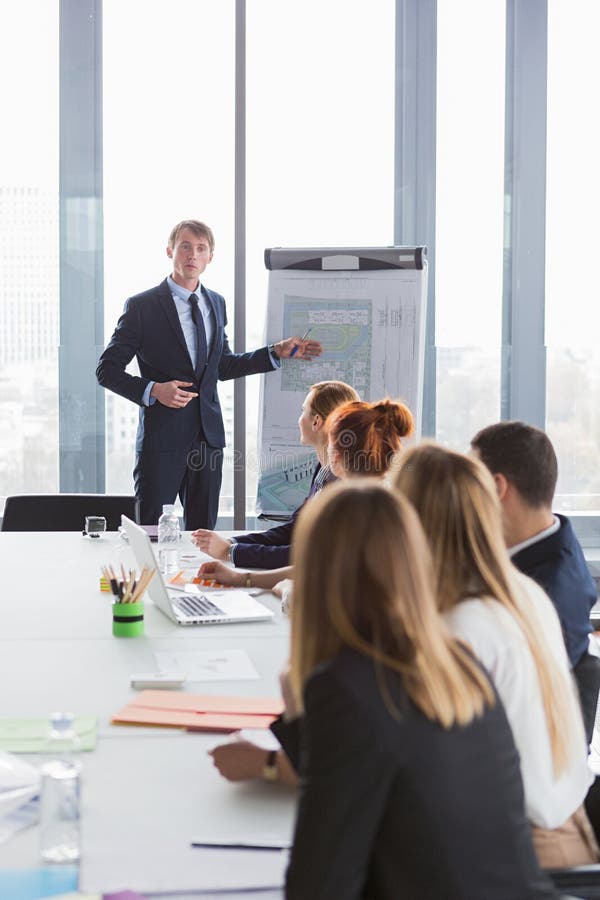 Business Man Showing Ground-plan during Meeting Stock Image - Image of ...