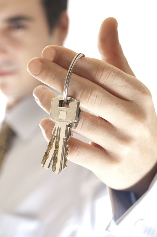 Business man showing key stock photo. Image of showing - 18593588