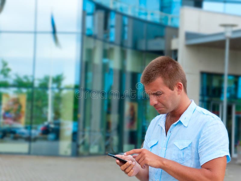 Business Man Speaking on Phone in Front of Modern Business Building ...