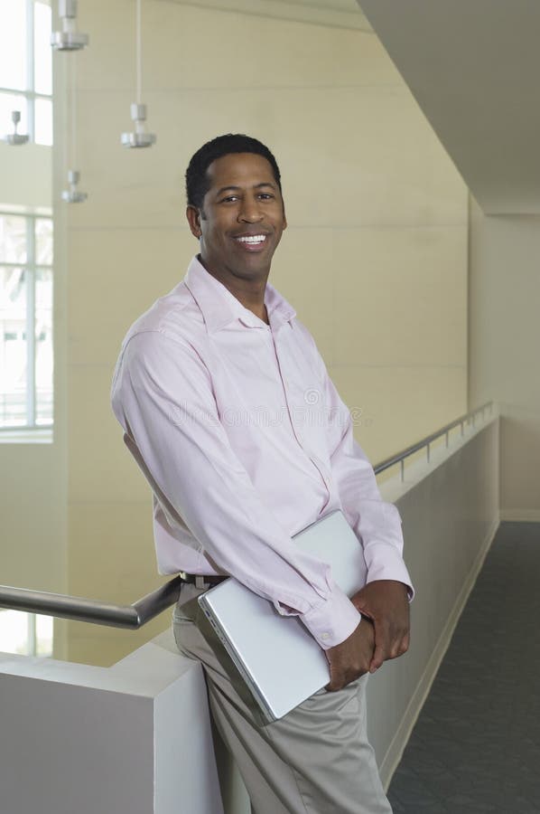 Business Man Standing by Balustrade in Office Building Stock Image ...