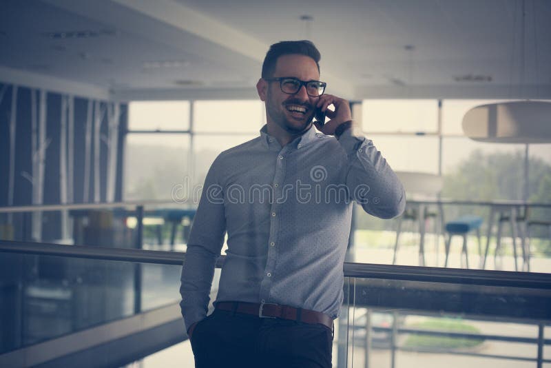 Business Man Standing in Business Building. Stock Image - Image of ...