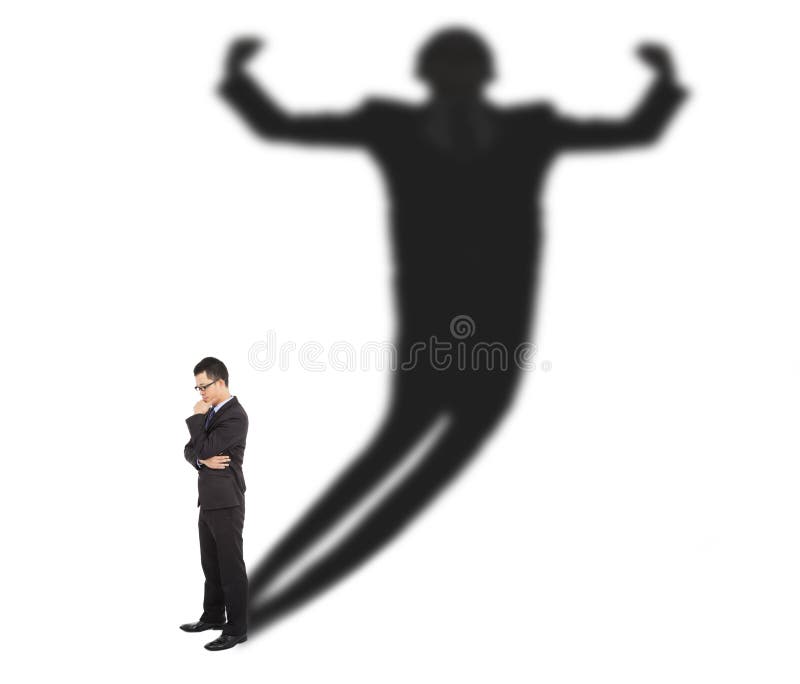Business Man Standing And Casting Shadow Of A Strong Man Stock Images ...
