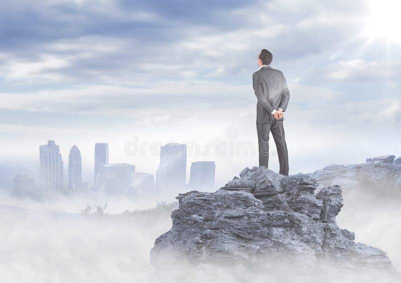 Business Man Standing on Rock Looking at Misty Skyline Stock Image ...