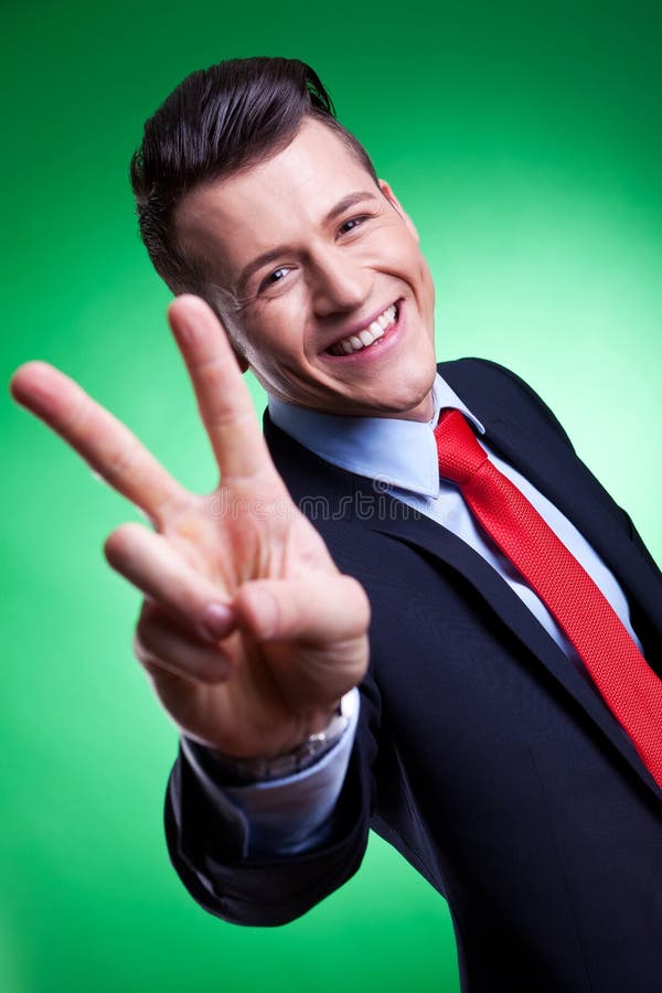 Business Man in a Suit Giving the Victory Sign Stock Image - Image of ...