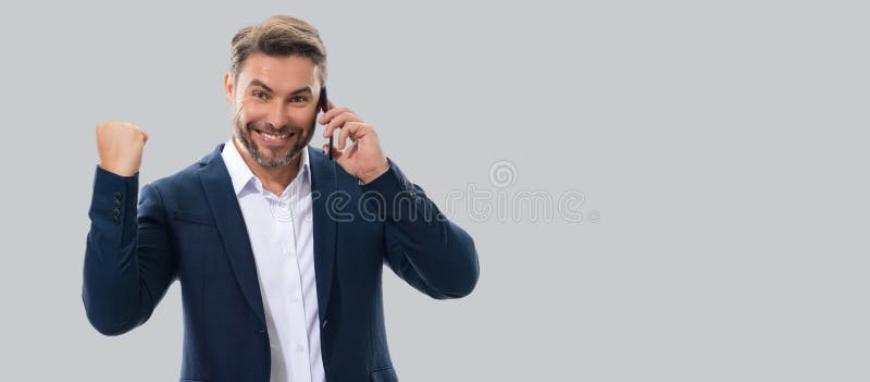 Business Man in Suit Watching on Mobile Phone. Handsome Man Using Smart ...
