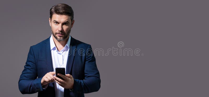 Business Man in Suit Watching on Mobile Phone. Handsome Man Using Smart ...