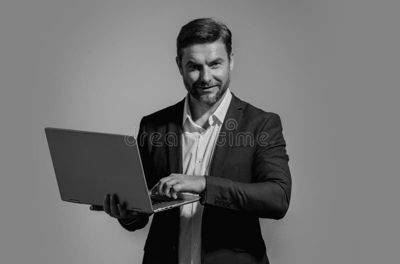 Business Man in Suit Working on Laptop in Studio. Man Checking Email on ...