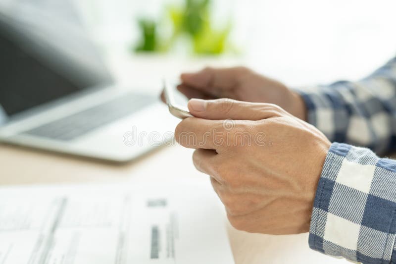 Business Man Use Phone To Scan Barcode or QR Codes To Pay Credit Card ... Business Man Use Phone To Scan Barcode or QR Codes To Pay Credit Card ...