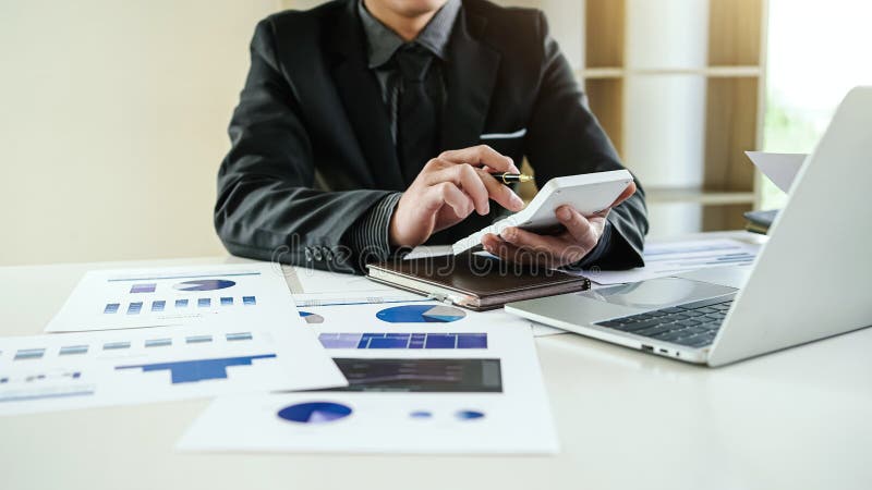 Business Man Using Calculator with Computer Laptop, Wearing a Black ...