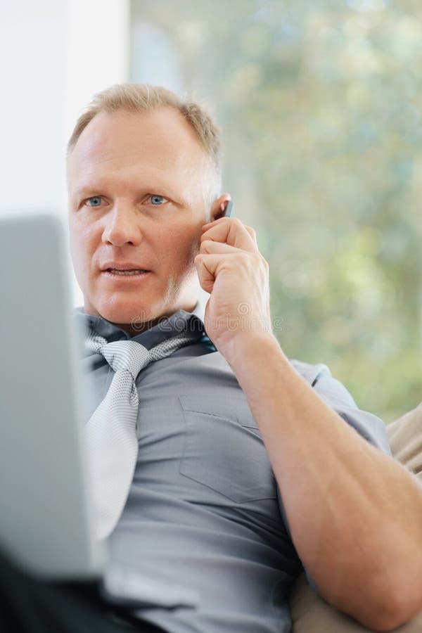 Business Man Using a Cellphone and Laptop Stock Photo - Image of male ...