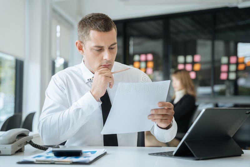 Business Man Using Digital Tablet Analyzes Business Data, Busy Working ...