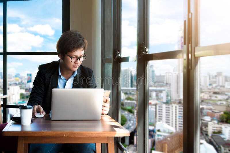 Business Man Using His Laptop and Smartphone Stock Image - Image of ...
