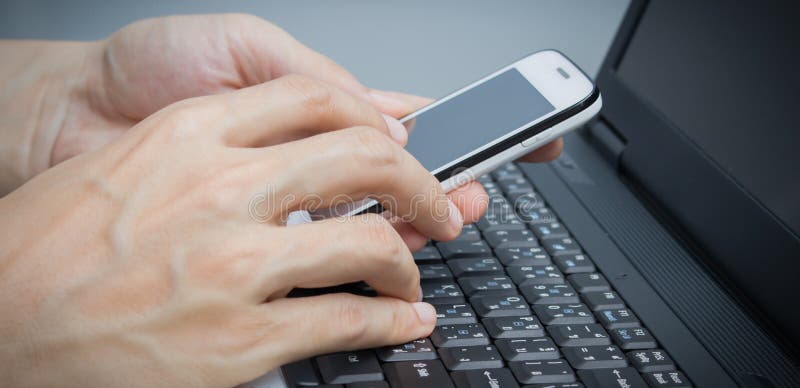 Business Man Using Internet on Smart Phone and Laptop. Stock Image ...