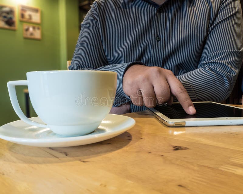 Business Man Using Internet on Tablet in Cafe Coffee Shop with W Stock ...