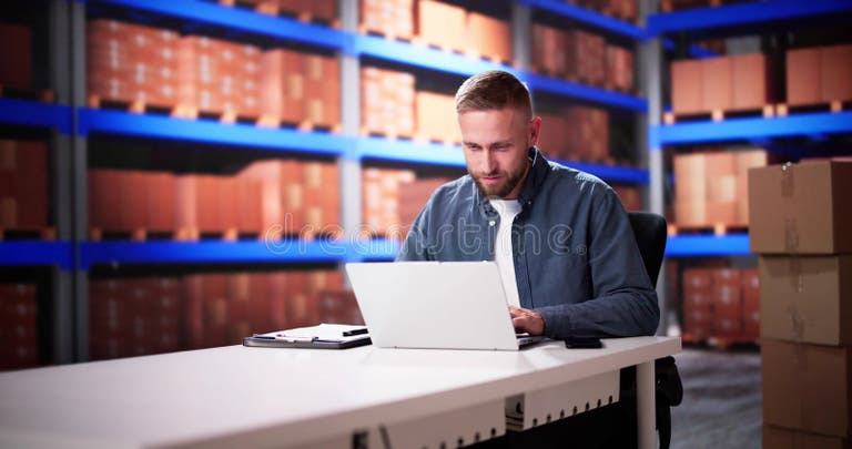 Business Man Using Laptop Computer in Warehouse Stock Photo - Image of ...