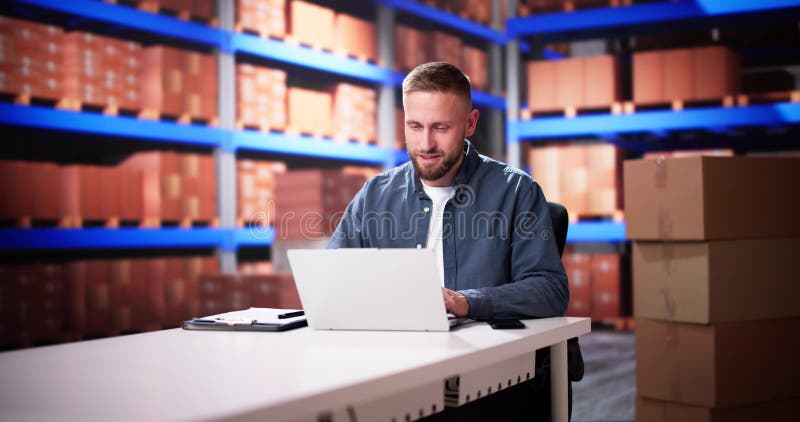Business Man Using Laptop Computer in Warehouse Stock Photo - Image of ...