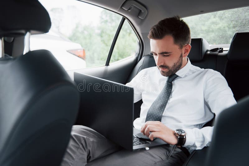 Business Man Using Laptop for Working in Car Stock Photo - Image of ...