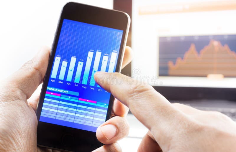 Business Man Using a Mobile Phone Device with Graph. Stock Image ...