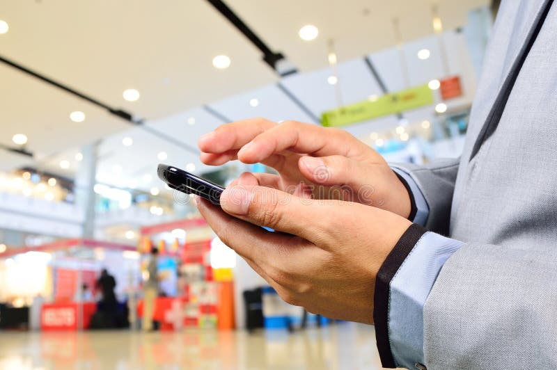 Business Man Using Mobile Phone while Shopping in Supermarket. Stock ...
