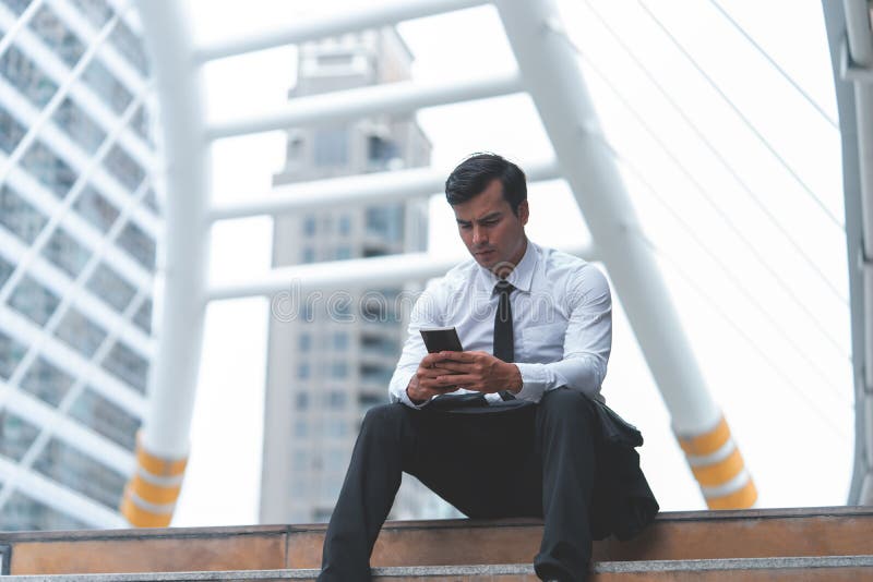 Business Man Using Mobile Phone Sitting Outdoor Stock Image - Image of ...