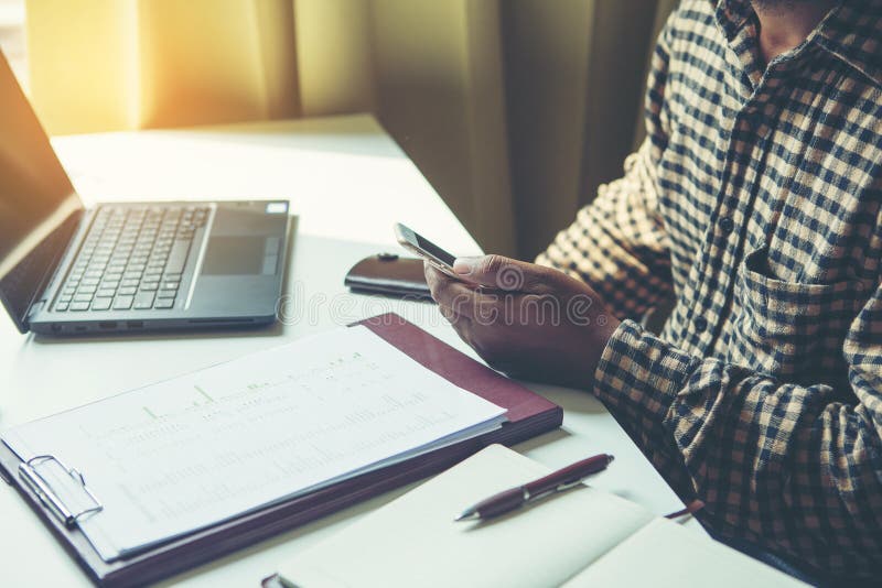 Business Man Using Mobile Smart Phone, Busy Working on Laptop Computer ...