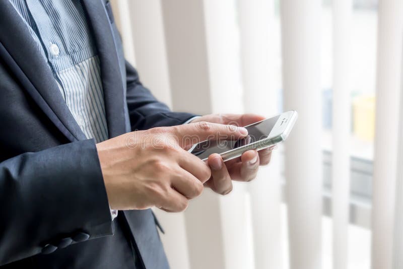 Business man using mobile stock image. Image of mobility - 73950405