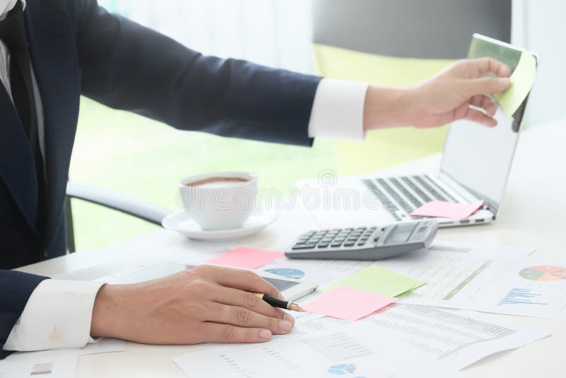 Business Man Using Post it Note Stick Memo and Report Finance Pa Stock ...