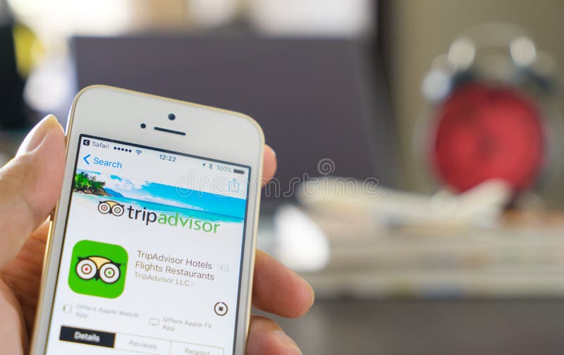 Business Man is Using Tripadvisor Application To Plan His Trip ...