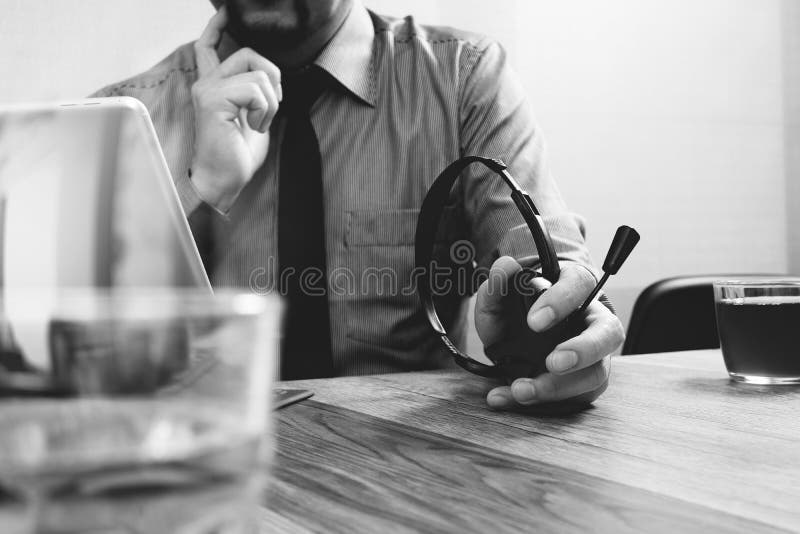 Business Man Using VOIP Headset with Digital Tablet Computer Doc Stock ...