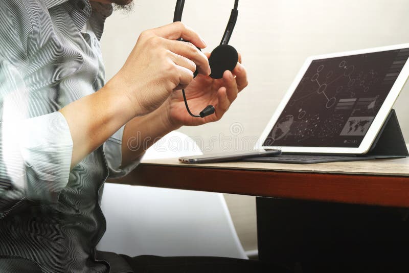 Business Man Using VOIP Headset with Digital Tablet Computer Doc Stock ...