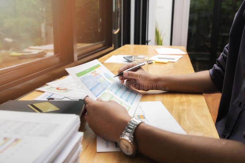 Business Man Viewing Summary and Annual Report at Office. Businessman ...