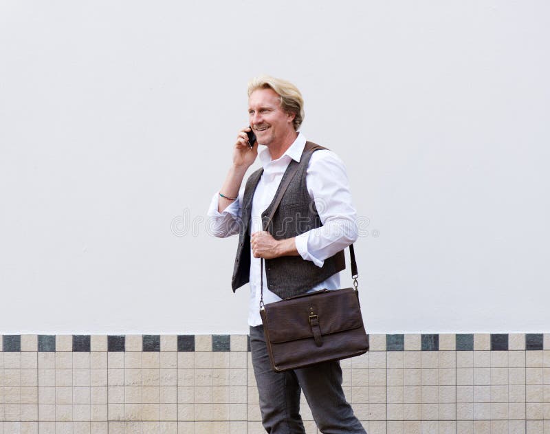 Business Man Walking and Talking on Cellphone Stock Image - Image of ...