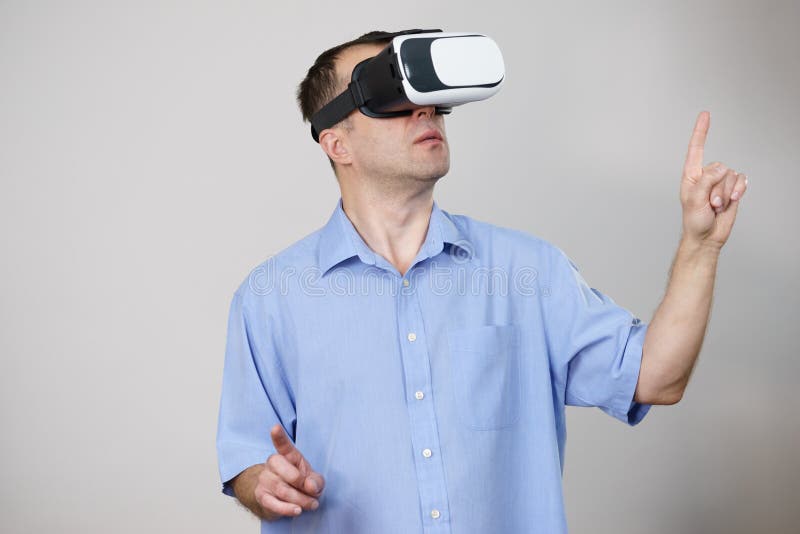 Man Wearing Virtual Reality Goggles on Grey Stock Image - Image of ...