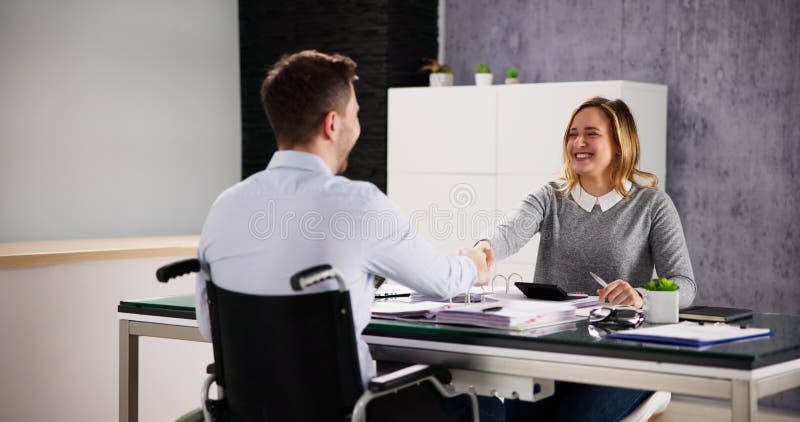 Business Man in Wheel Chair Shaking Hand Stock Image - Image of chair ...