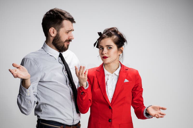 The Business Man And Woman Communicating On A Gray Background Stock