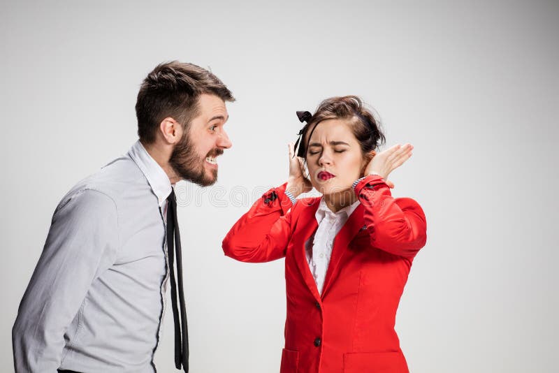 The Business Man And Woman Communicating On A Gray Background Stock