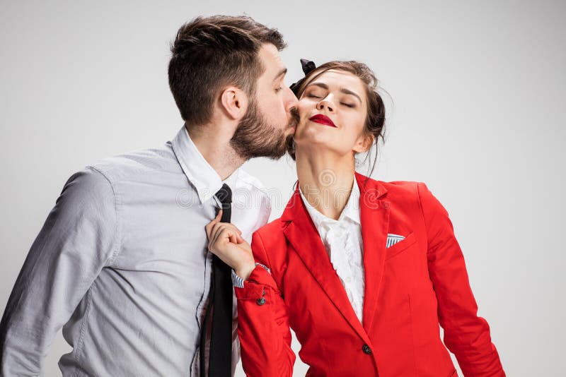 The Business Man And Woman Communicating On A Gray Background Stock