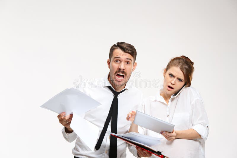 The Business Man And Woman Communicating On A Gray Background Stock