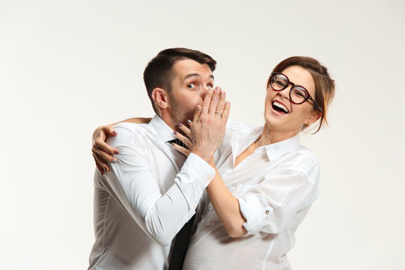 The Business Man And Woman Communicating On A Gray Background Stock